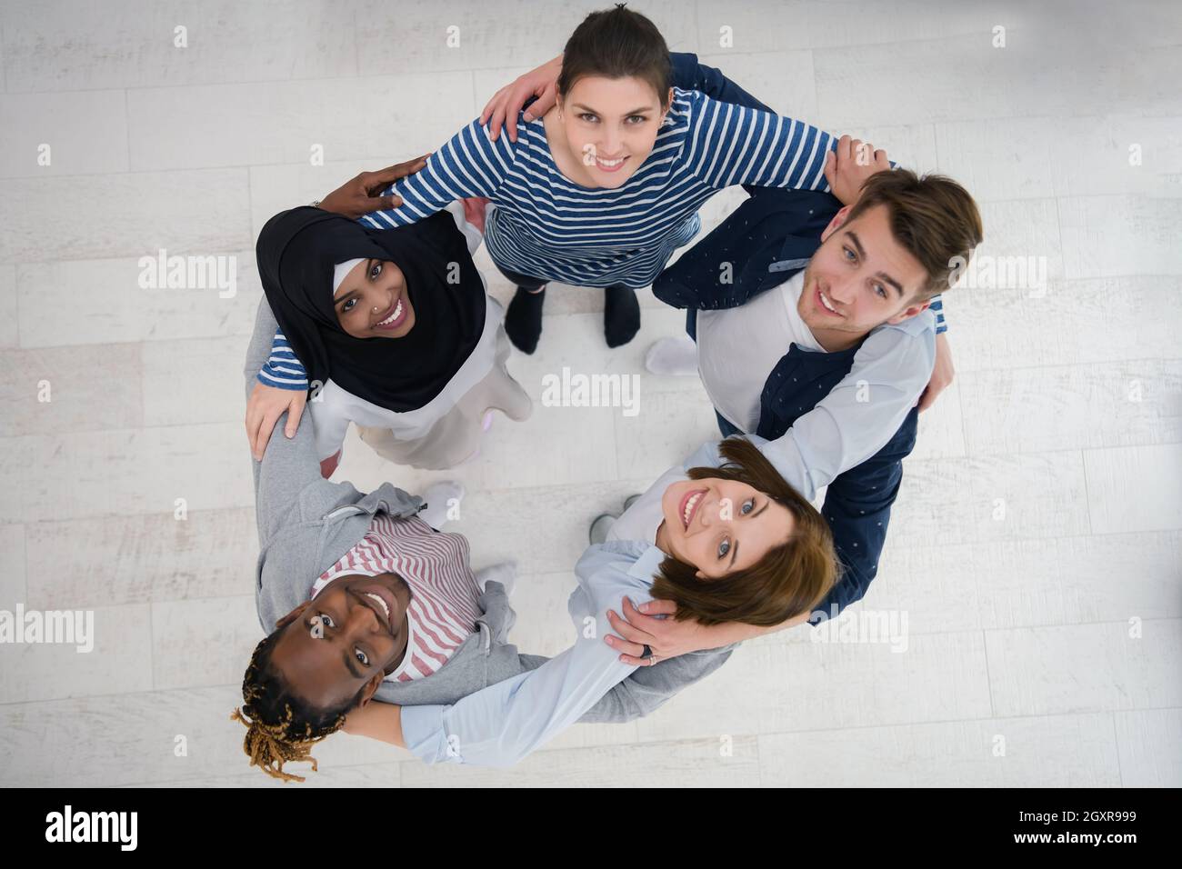 a top view of diverse group of people standing embracing and ...