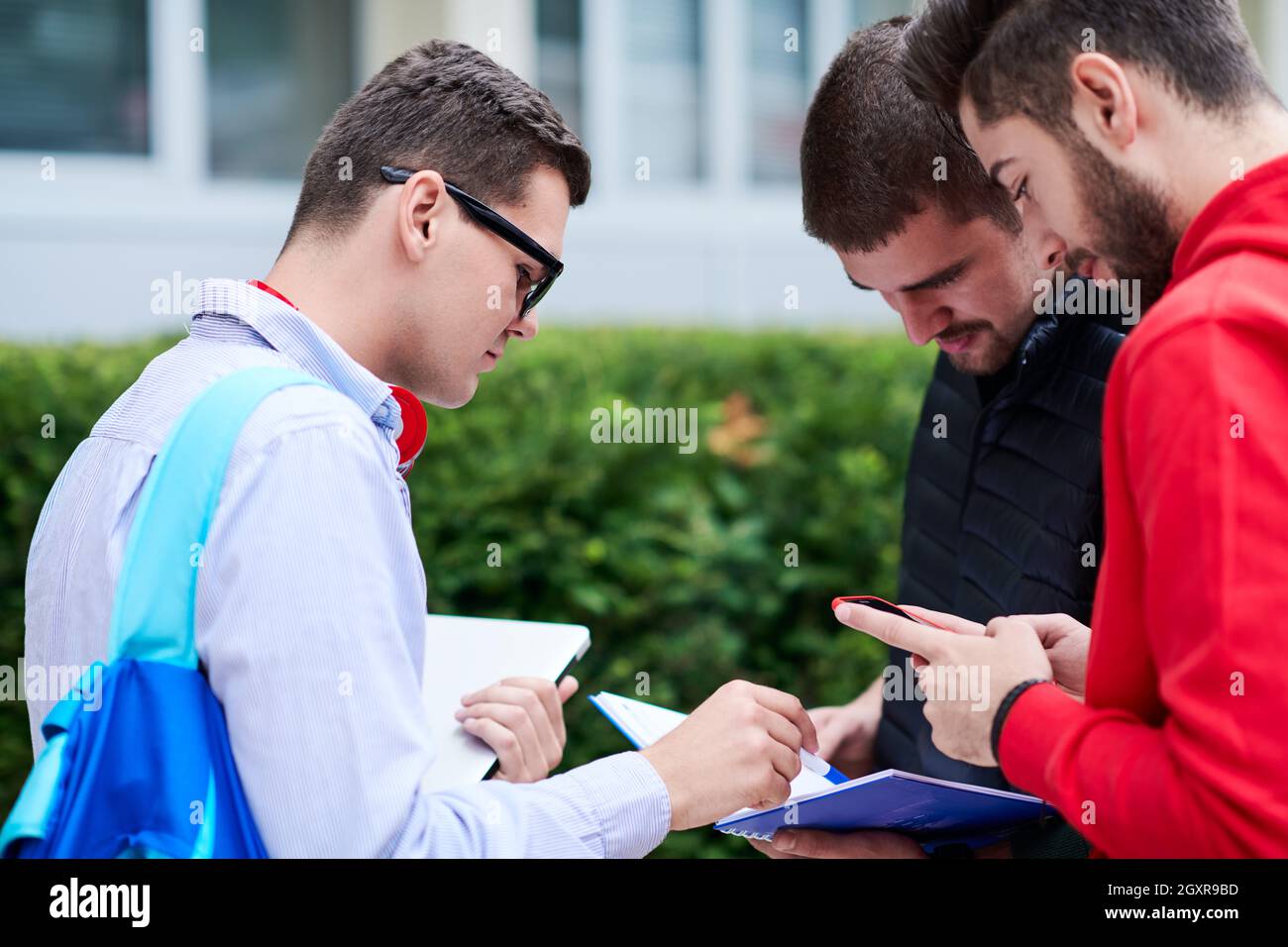 students use smart phones to create a project for the school Stock ...