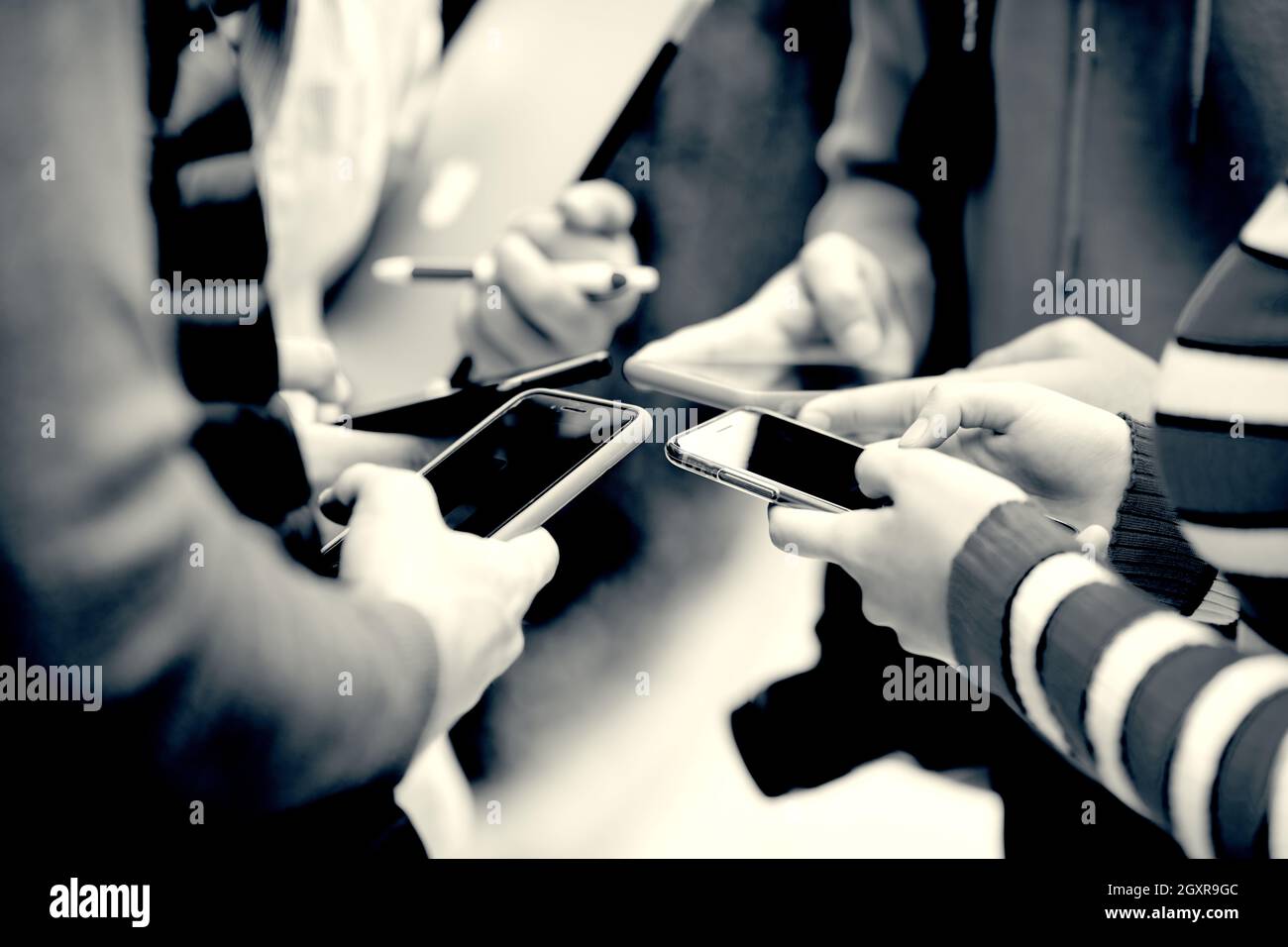 students use smart phones to create a project for the school Stock ...