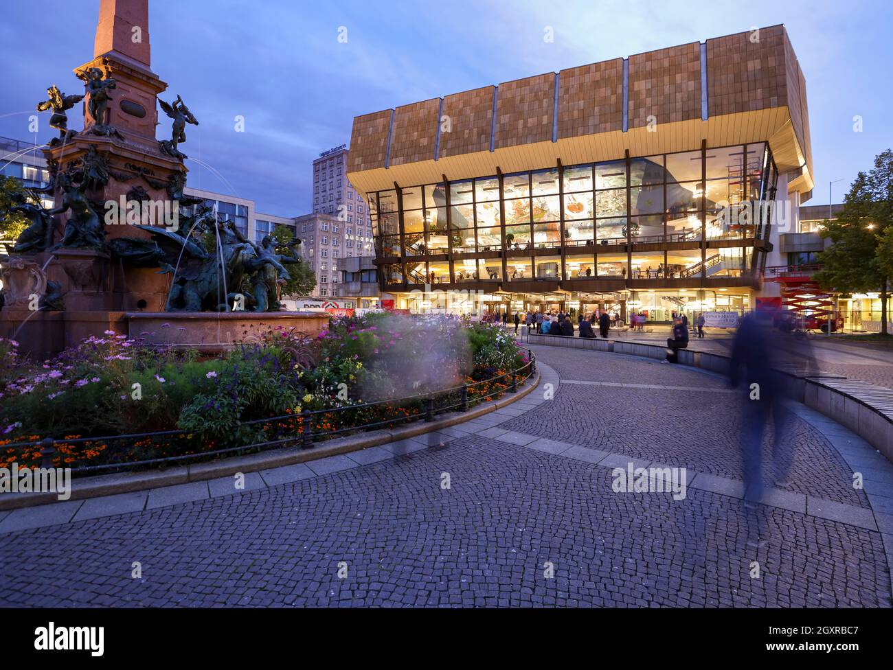 Leipzig, Germany. 04th Oct, 2021. Passers-by and guests walk across ...