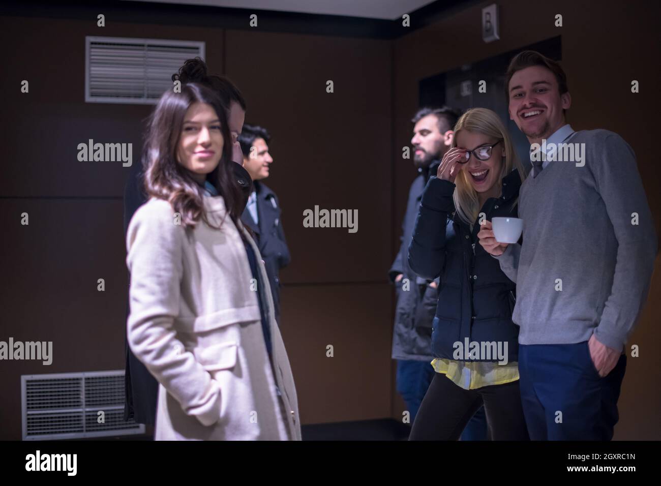 group of young multiethnic startup business team having a coffee break ...