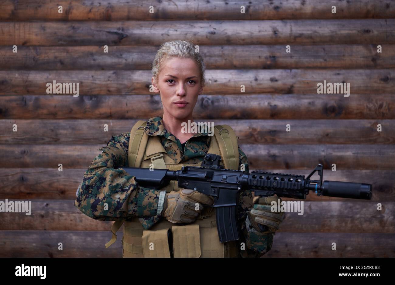 woman soldier ready for battle wearing protective military gear and ...