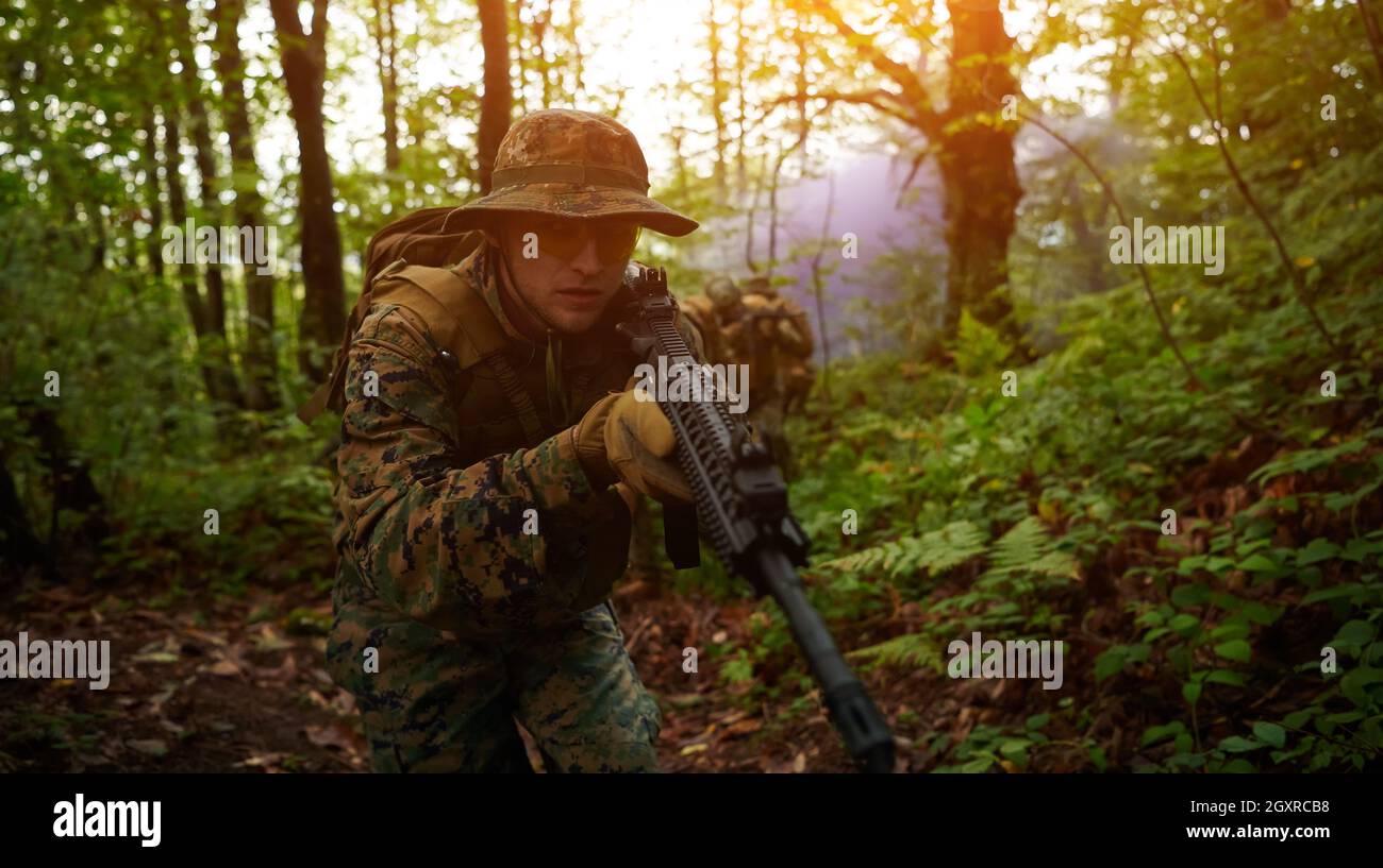 Modern warfare Soldiers Squad Running as Team in Battle Formation Stock ...