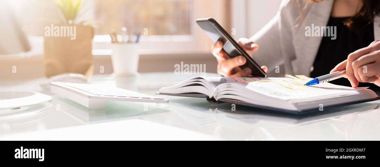 Calendar Schedule List In Diary And In Mobile Phone Stock Photo - Alamy