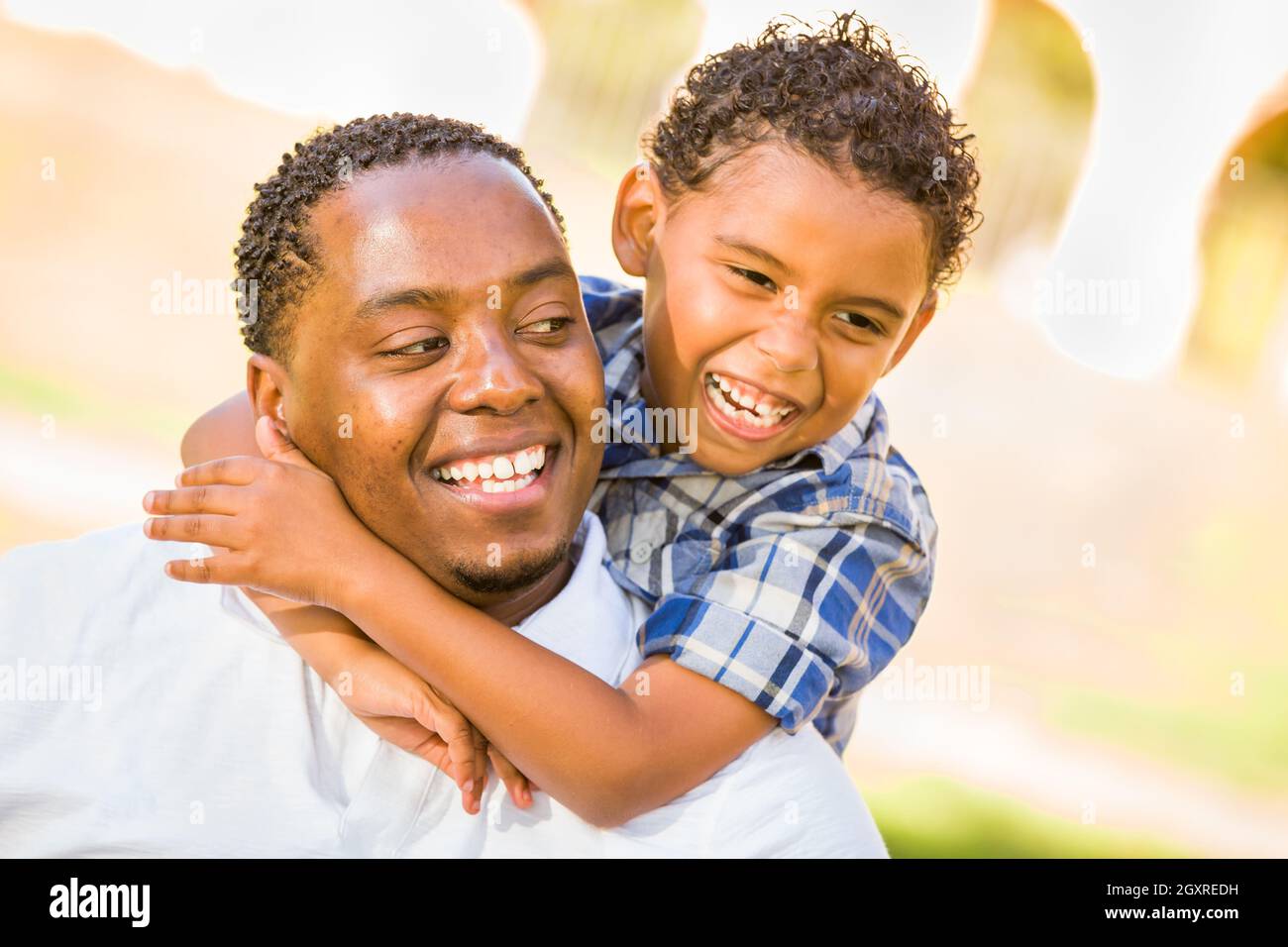 Happy African American Father And Mixed Race Son Playing At The Park