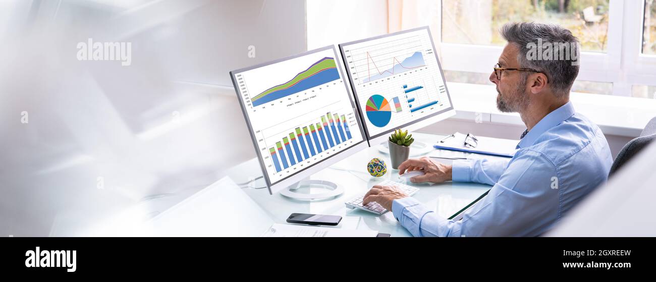 Happy older businessman using pc hi-res stock photography and images ...