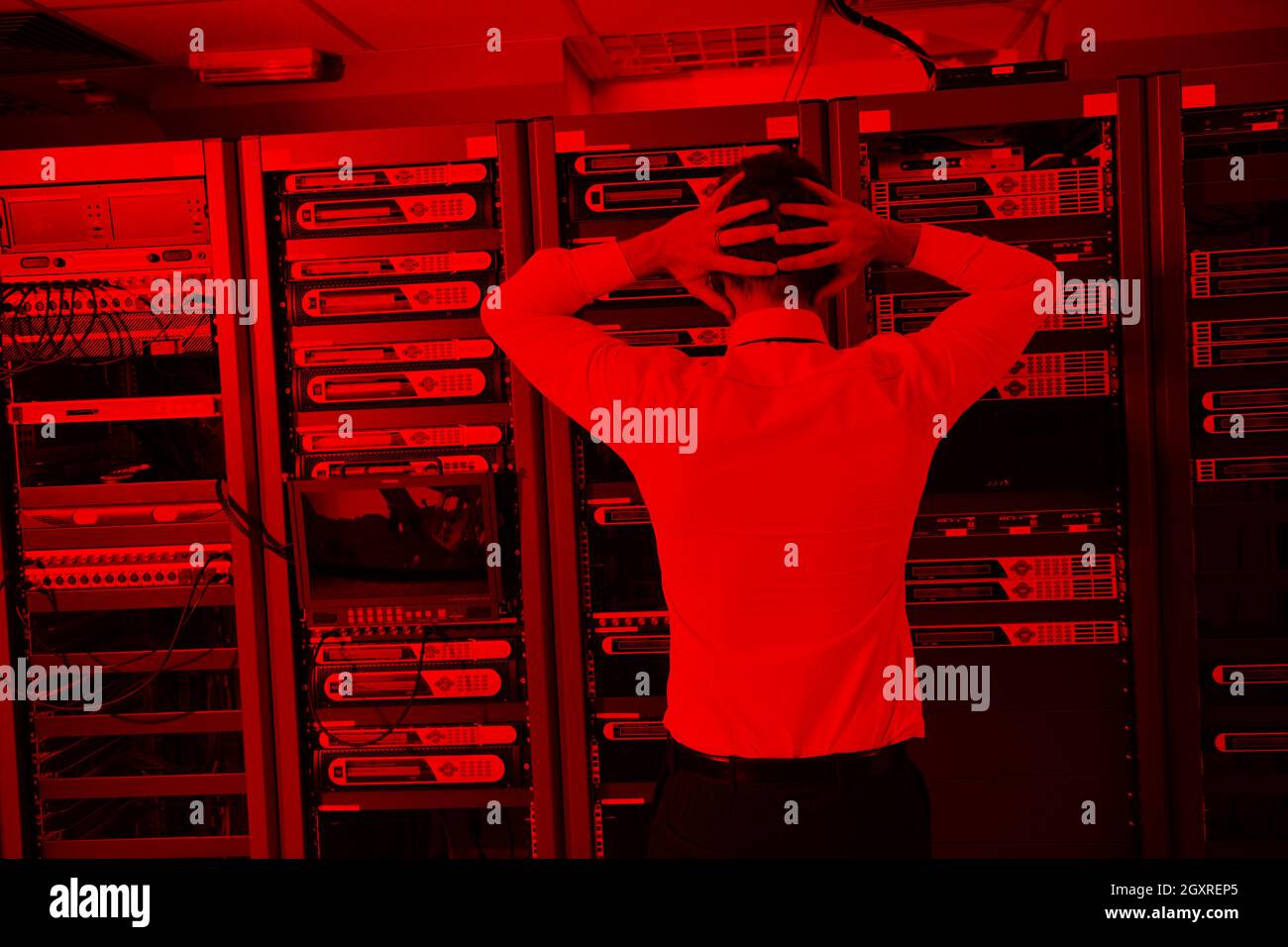 it business man in network server room have problems and looking for ...