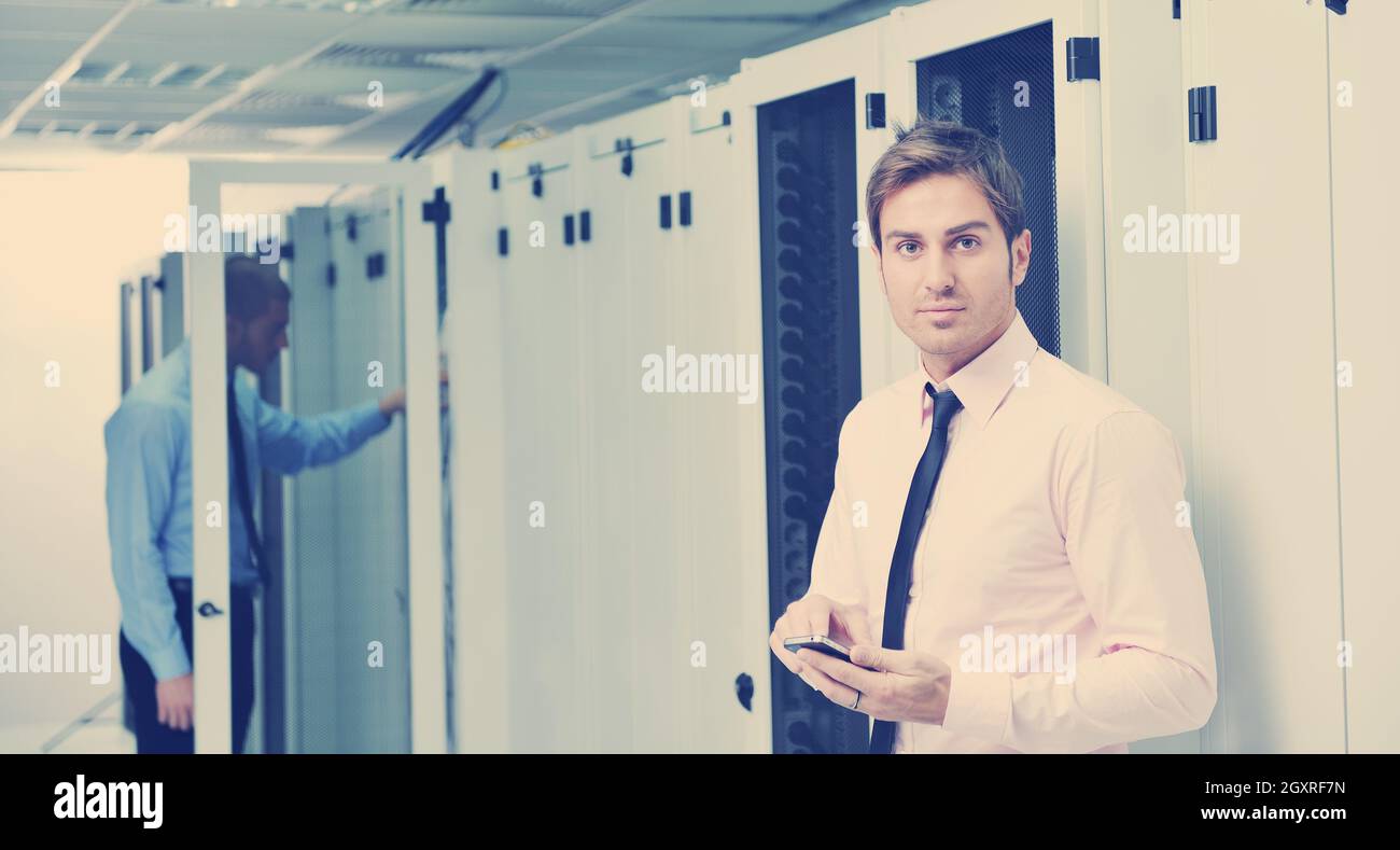 young business man computer science engeneer talking by cellphone at ...