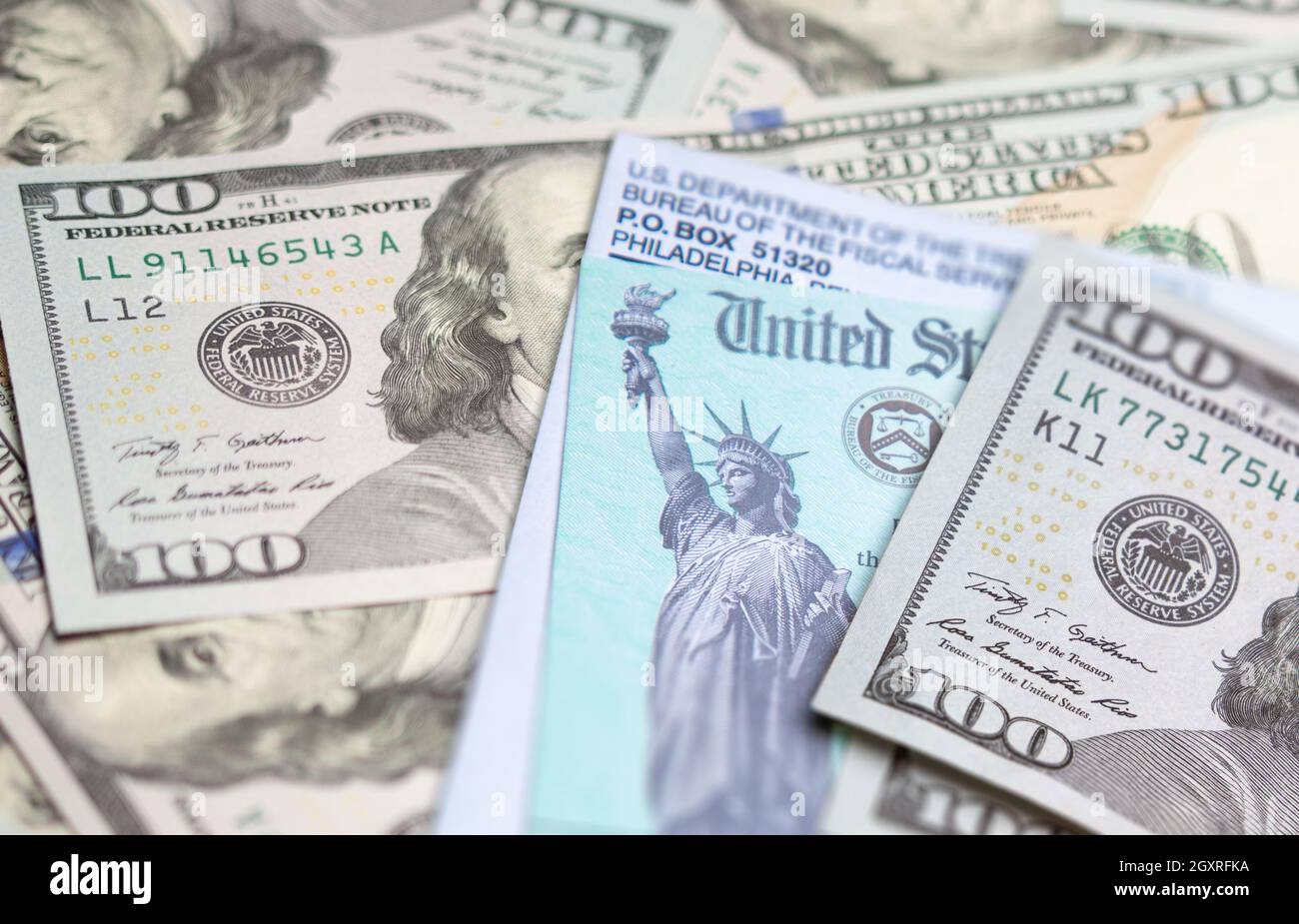 United States IRS Check and Envelope Resting on Money Stock Photo - Alamy