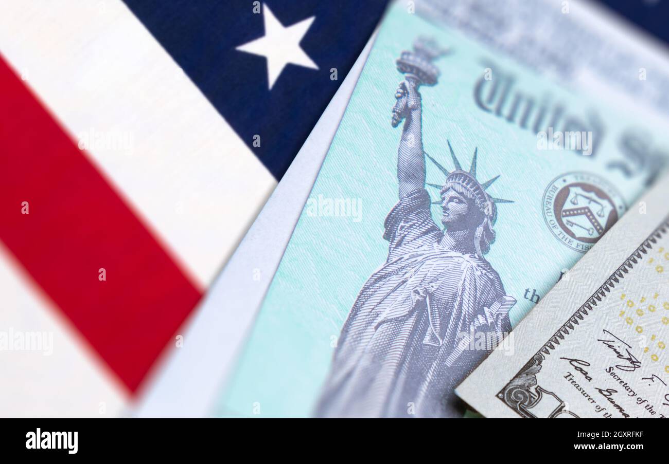 United States IRS Check, Envelope and Money Resting on American Flag ...