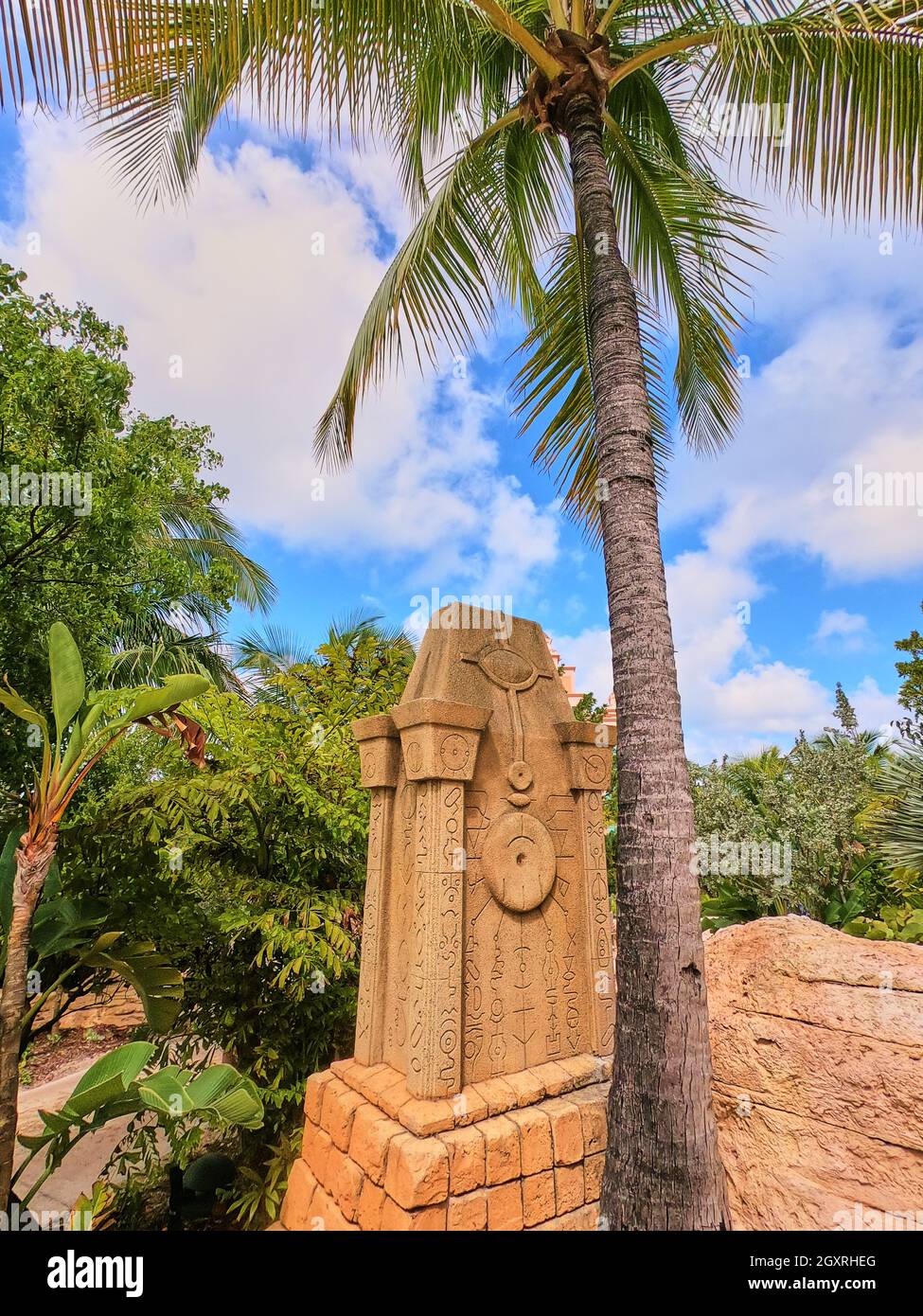 Tropical ancient architecture with palm tree Stock Photo - Alamy