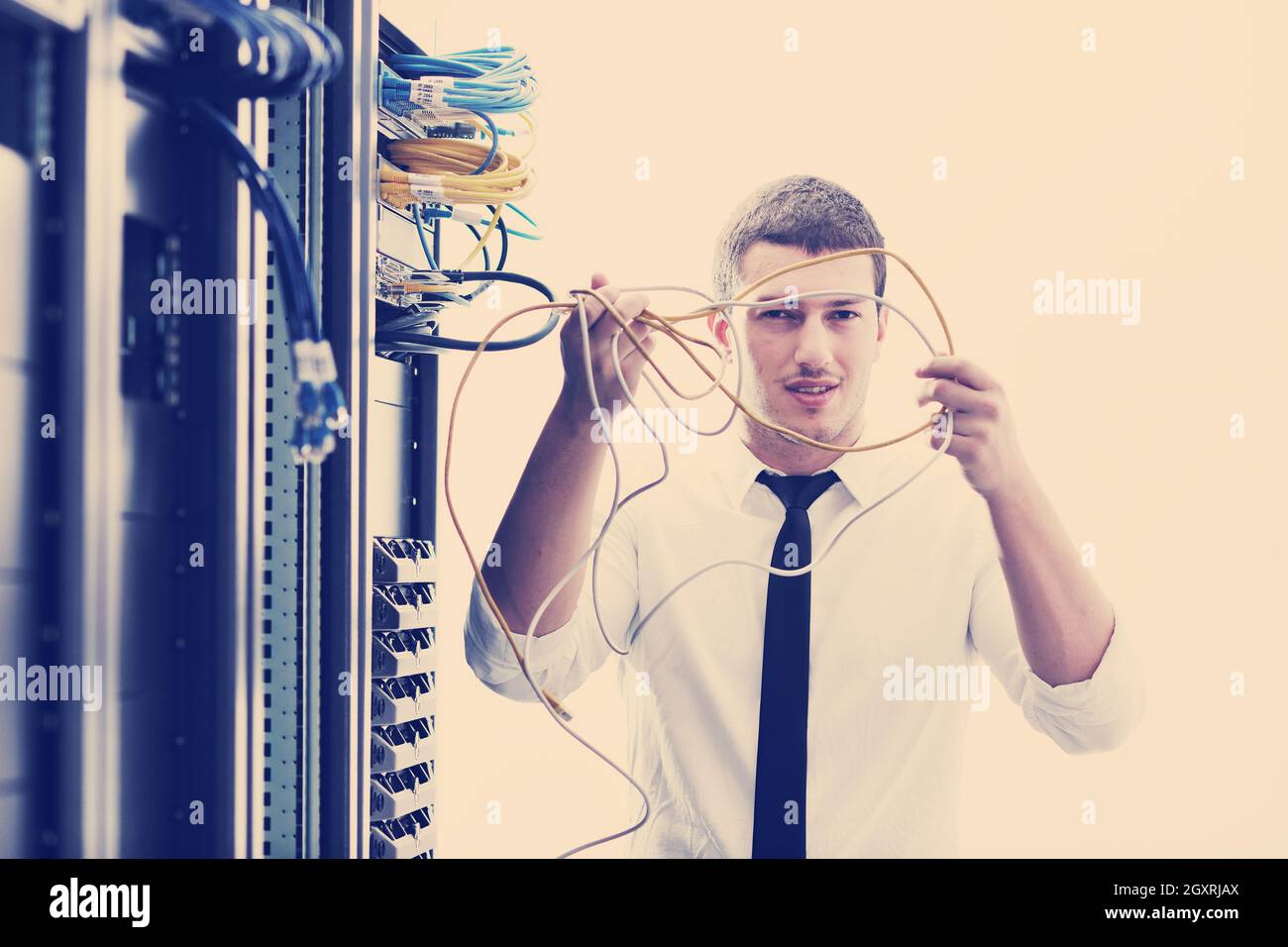 young handsome business man it engeneer in datacenter server room Stock ...