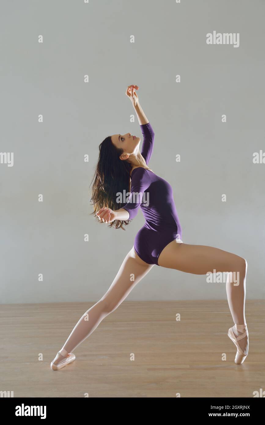 modern style ballet dancer posing and jumping on training Stock Photo ...