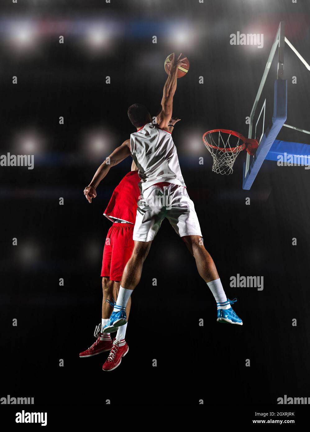 basketball game sport player in action in front of big modern ...