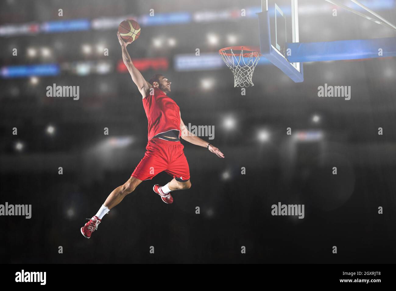 basketball game sport player in action in front of big modern ...