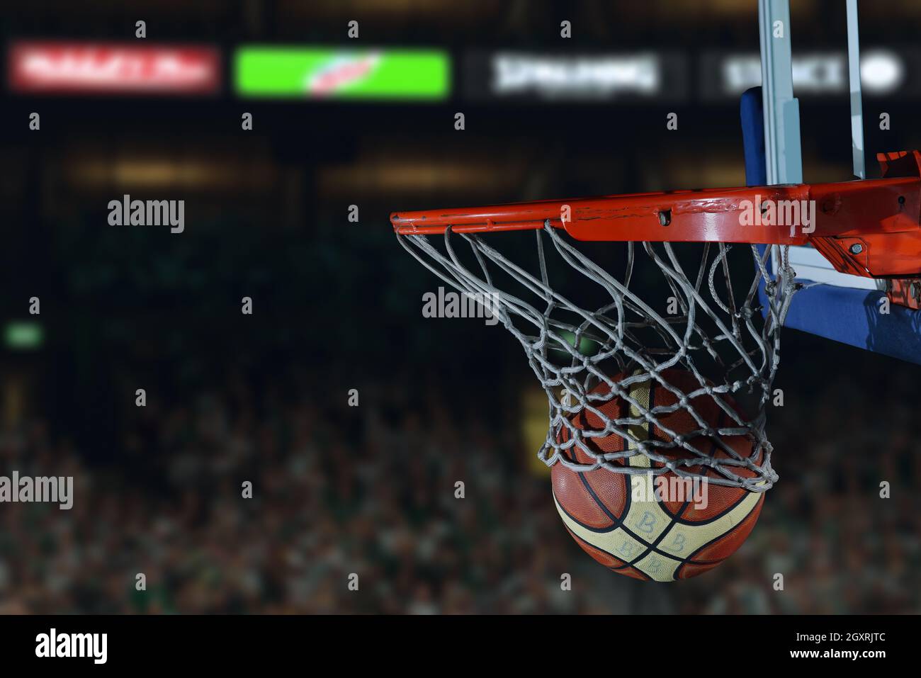 Basketball ball, board and net on black background in gym indoor Stock ...