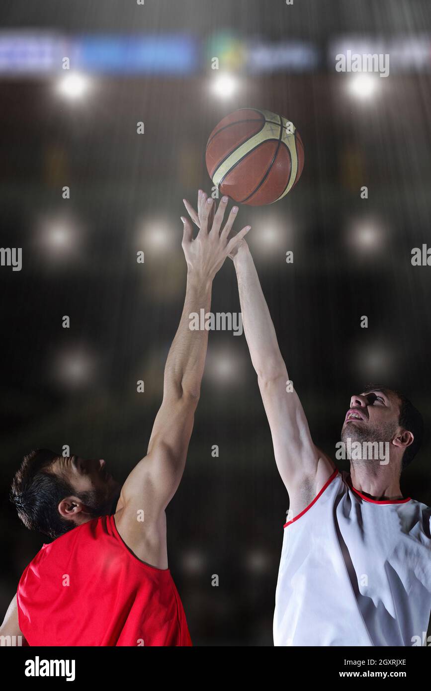 basketball game sport player in action in front of big modern ...