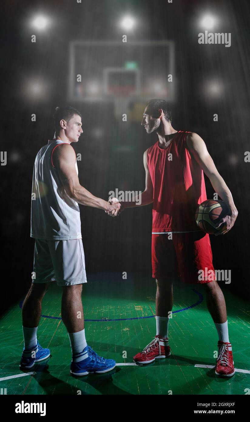 basketball game sport player in action in front of big modern ...