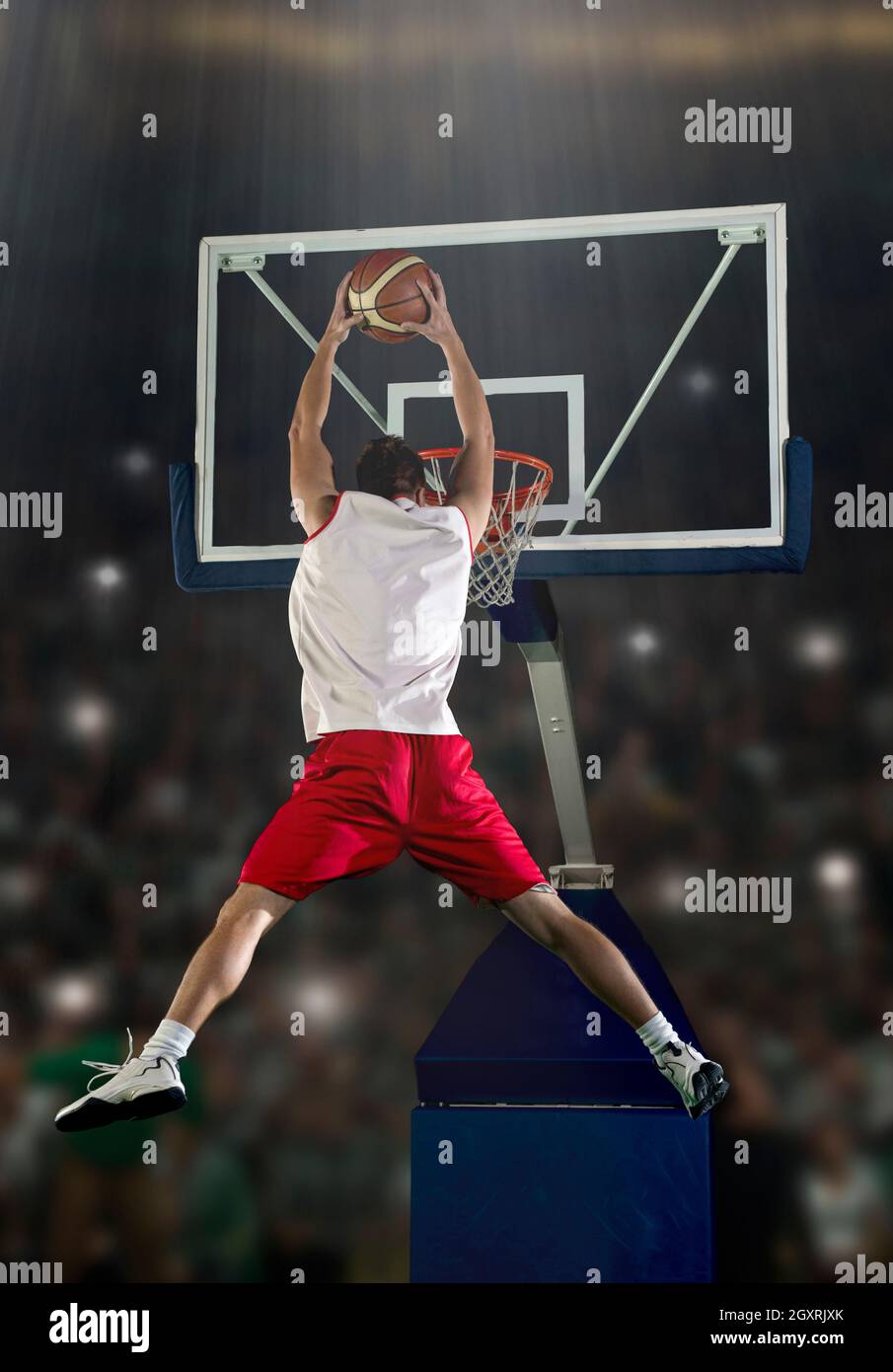 basketball game sport player in action in front of big modern ...