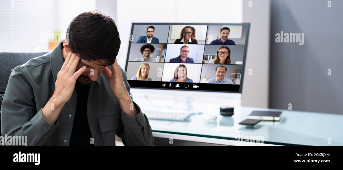 Bored Employee With Head Ache And Stress In Video Conference Call Stock ...