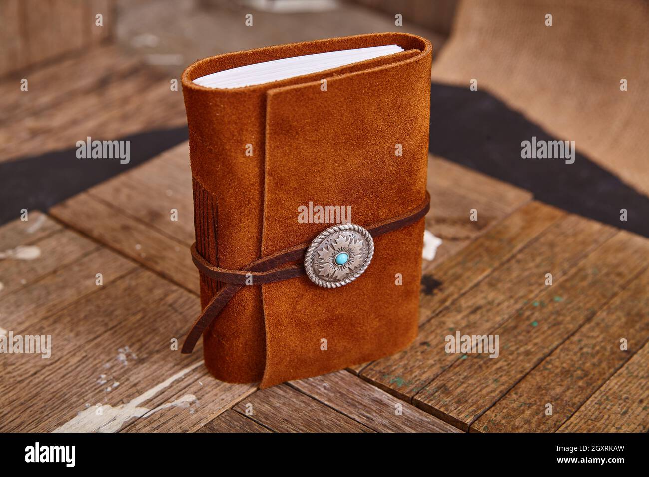Handcrafted brown leather journal with concho on wood boards Stock ...