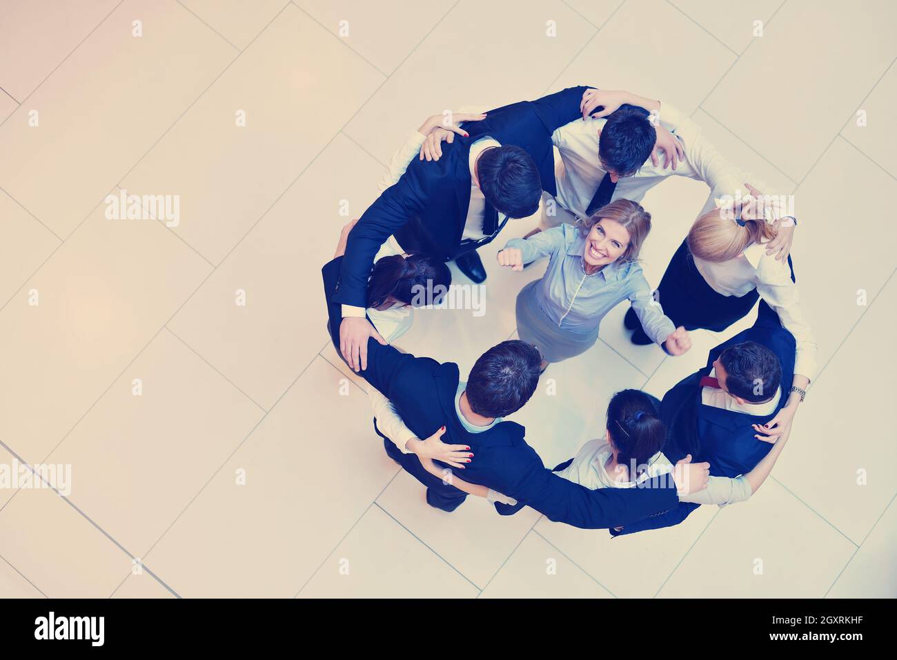 business people group joining hands and stay as team in circle and ...