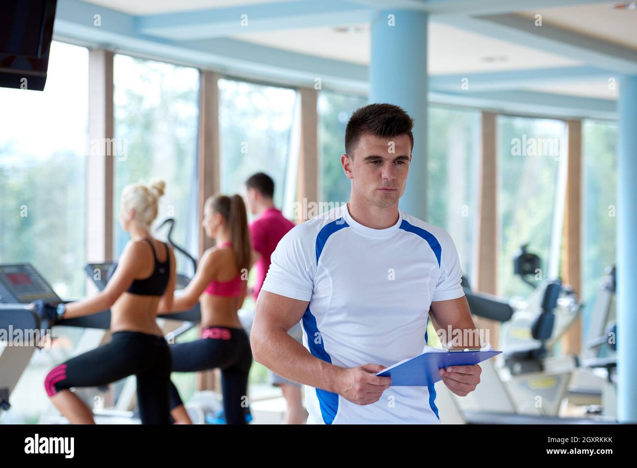 group portrait of healthy and fit young people in fitness gym Stock ...