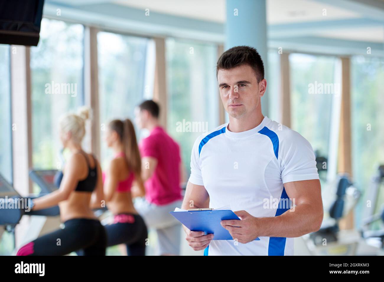 group portrait of healthy and fit young people in fitness gym Stock ...