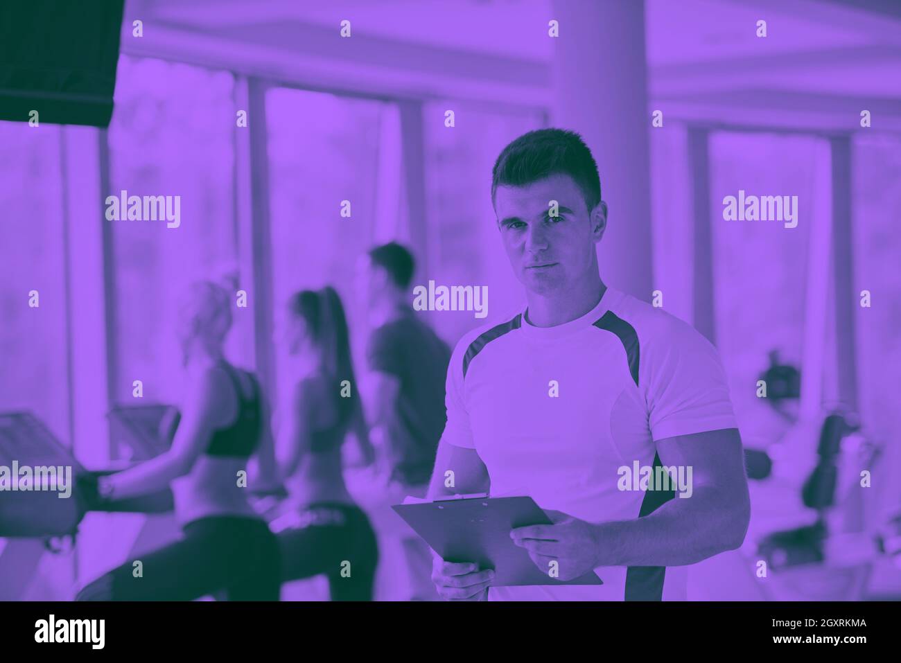 group portrait of healthy and fit young people in fitness gym duo tone ...