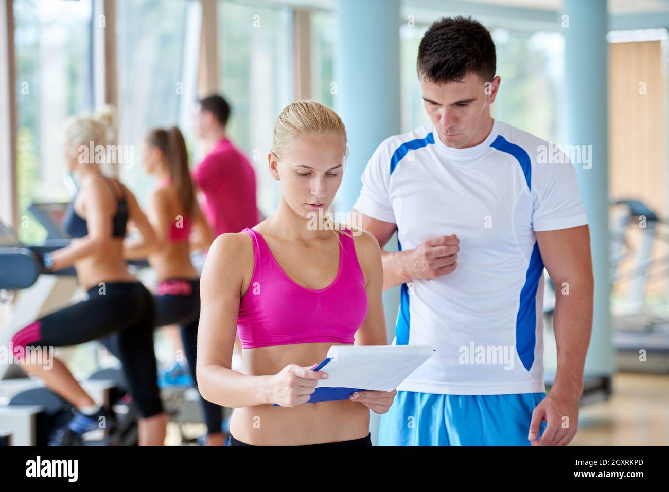 group portrait of healthy and fit young people in fitness gym Stock ...