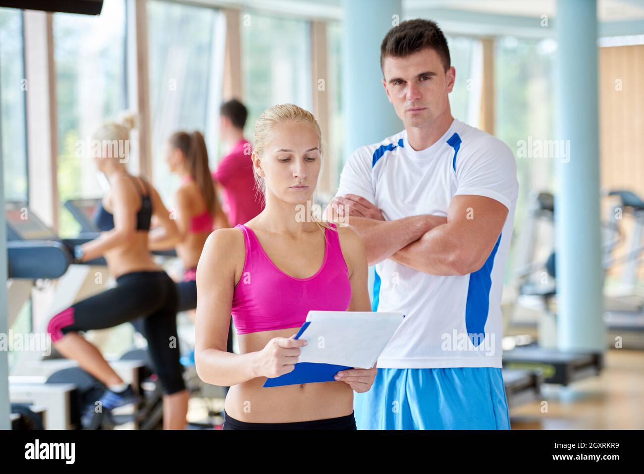 group portrait of healthy and fit young people in fitness gym Stock ...