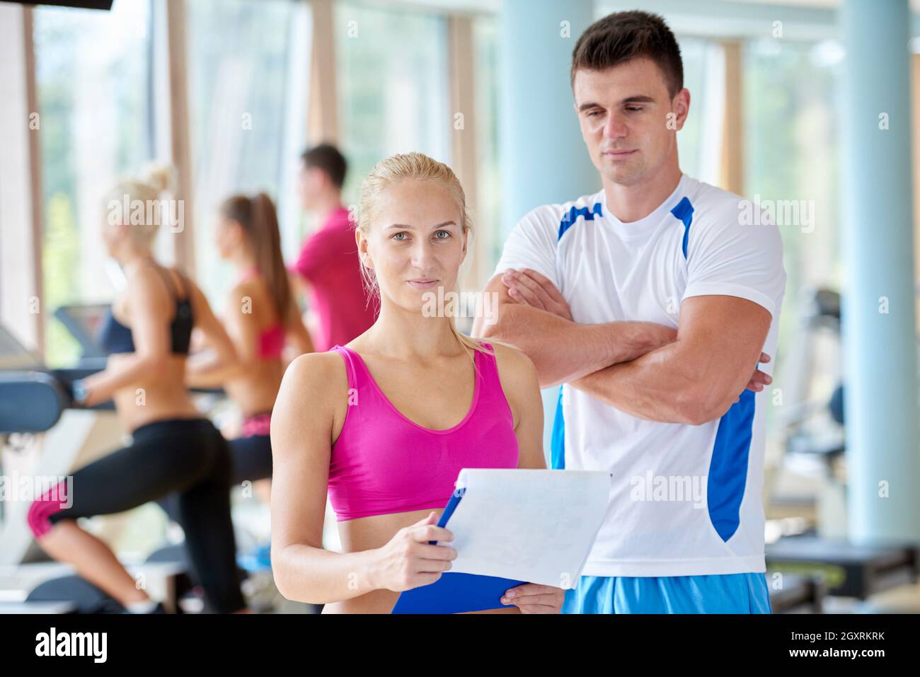 group portrait of healthy and fit young people in fitness gym Stock ...