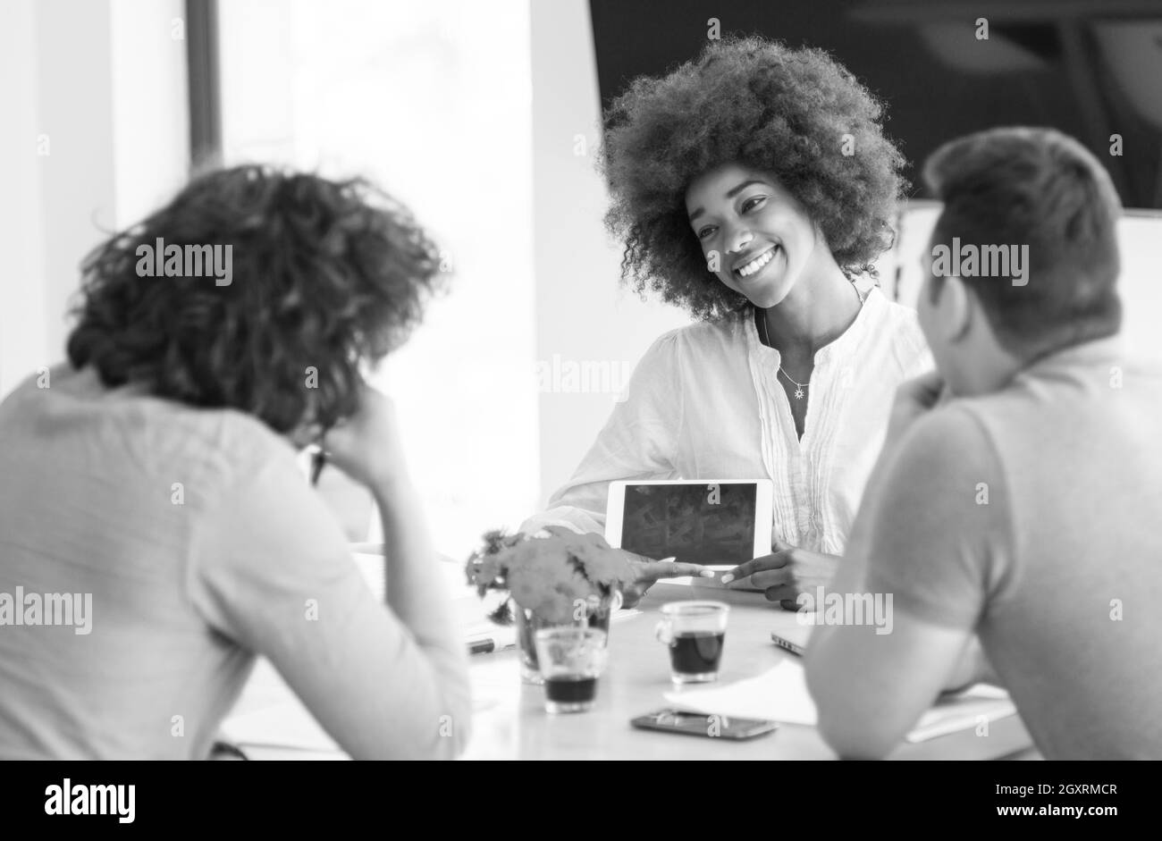Young team talking about the problem at work Stock Photo - Alamy