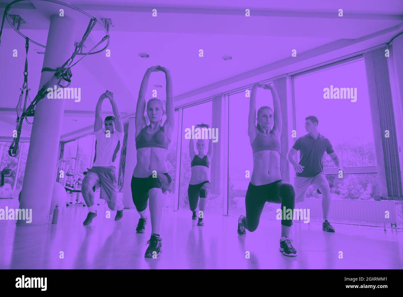 group of young people working out in a fitness gym duo tone Stock Photo ...