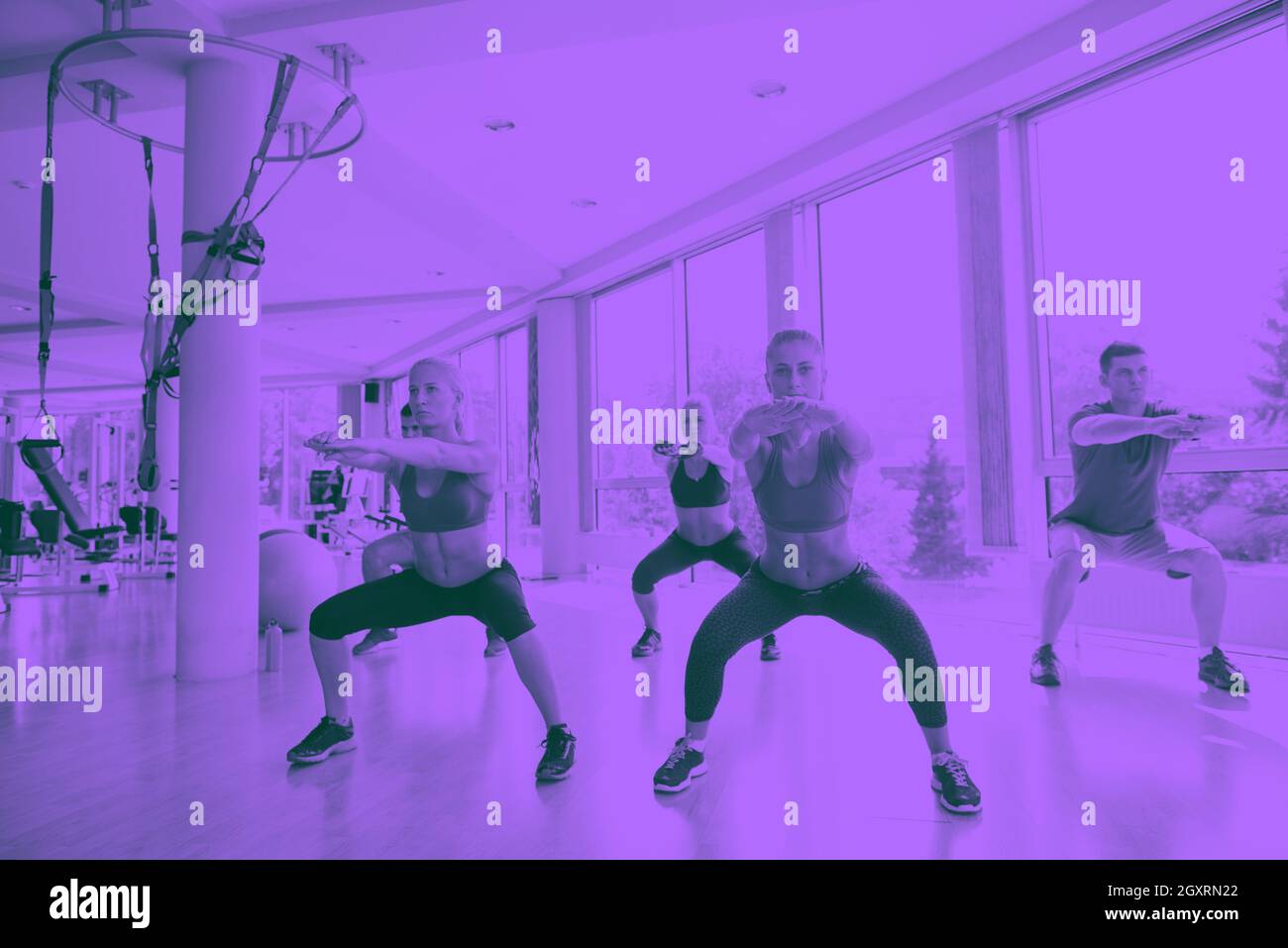 group of young people working out in a fitness gym duo tone Stock Photo ...