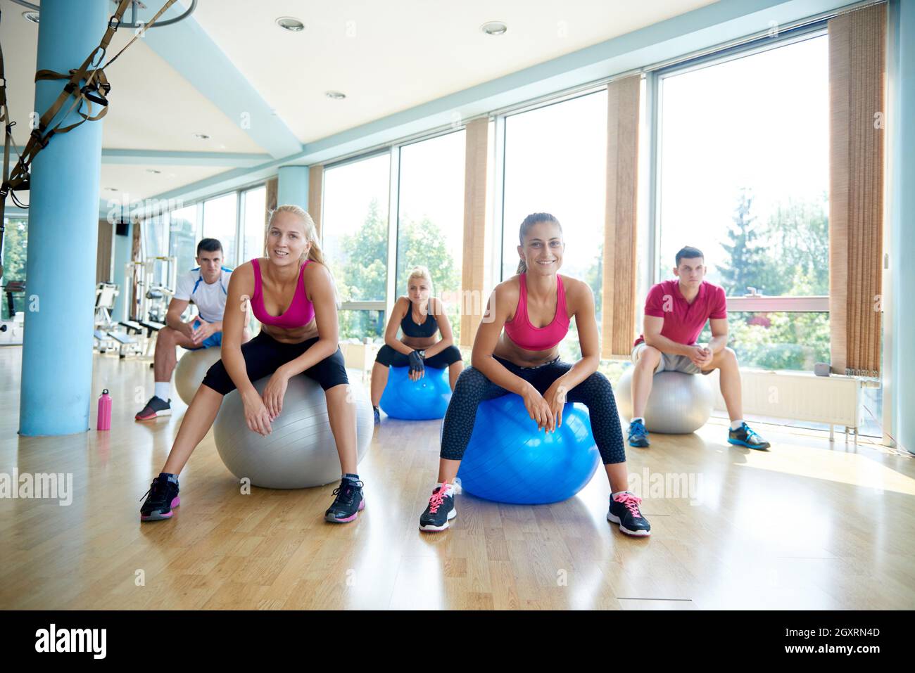 group of people exercise with balls on yoga class in fitness gym Stock ...