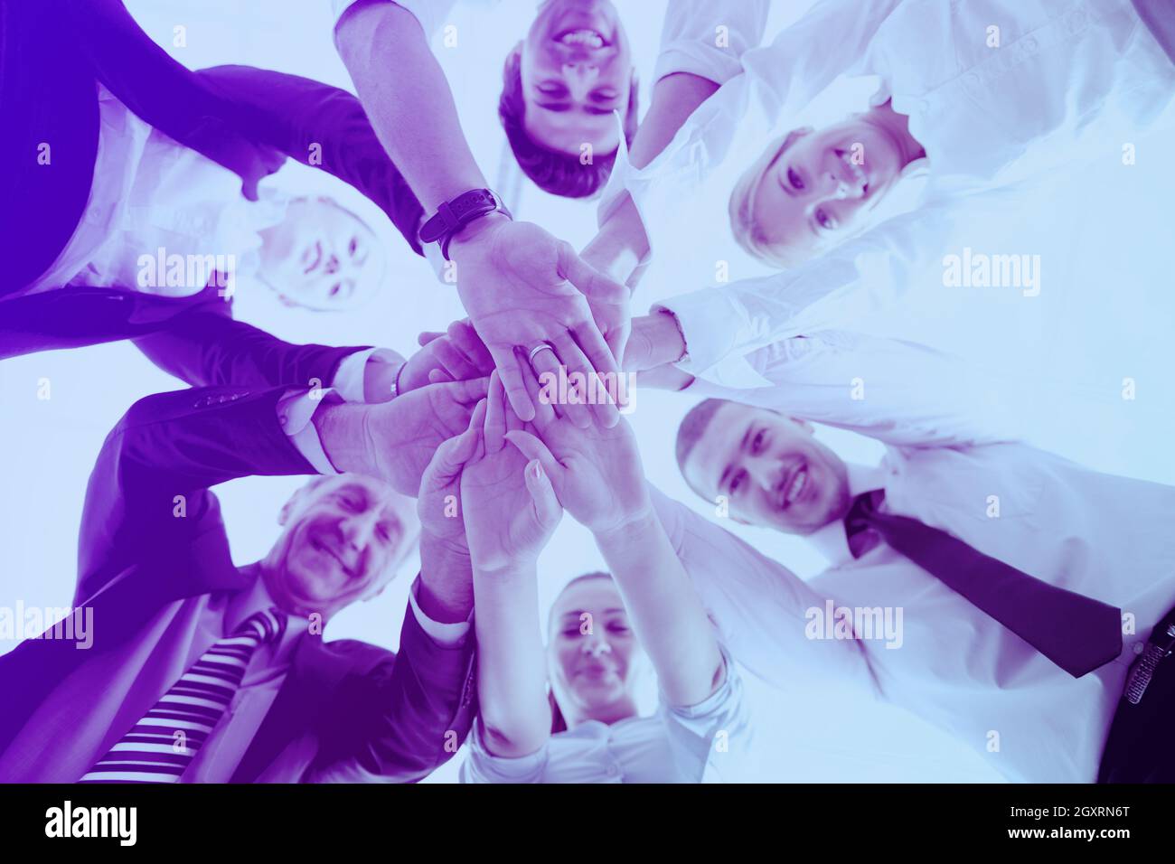 business people group joining hands and representing concept of friendship and teamwork, low ...