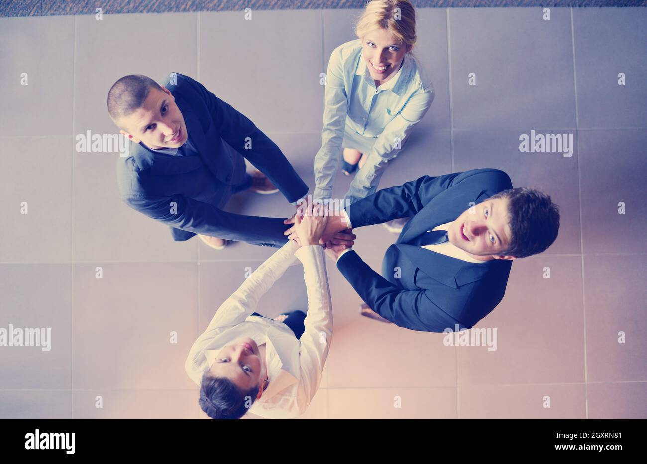 business people group joining hands and representing concept of friendship and teamwork, low ...
