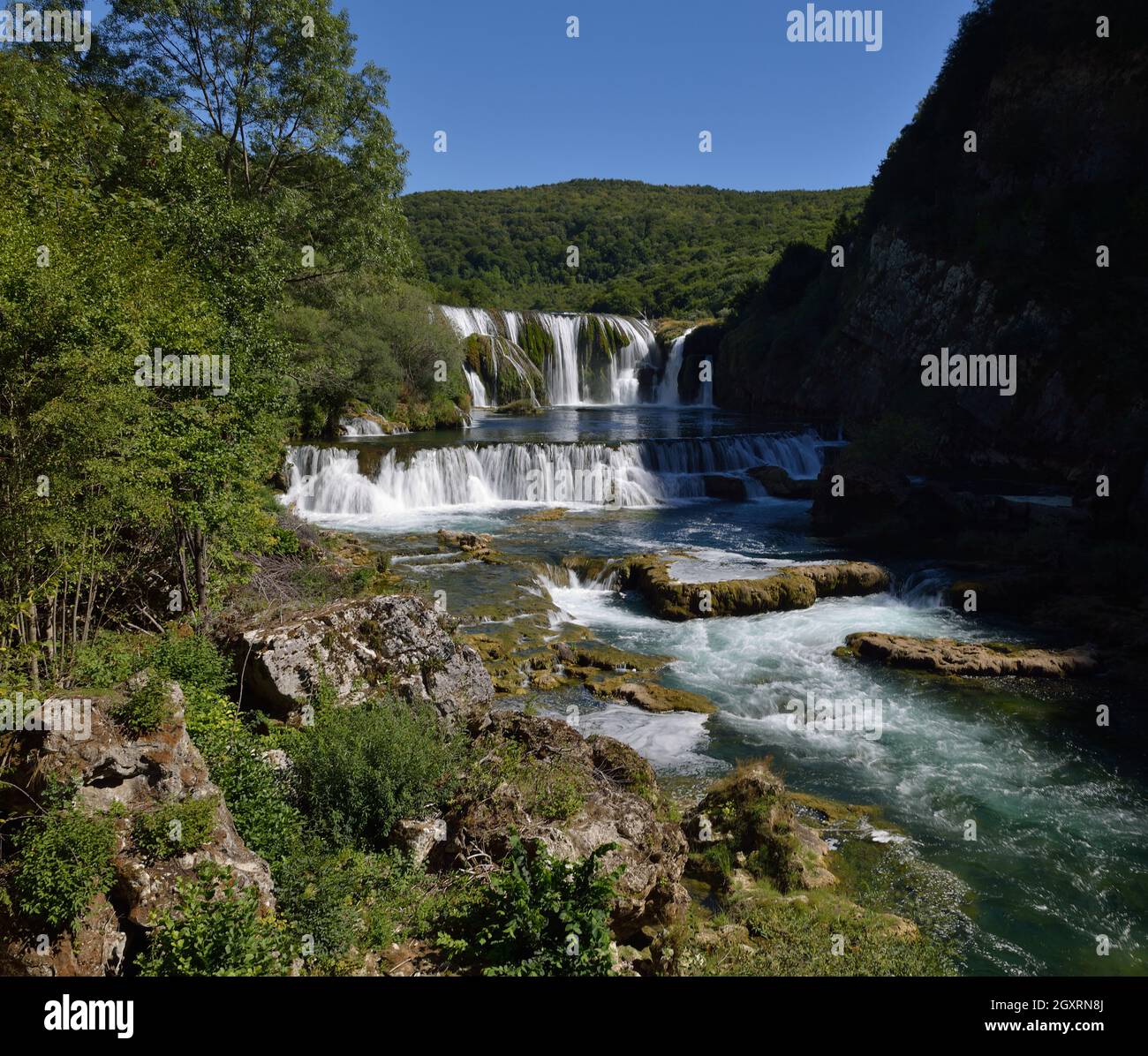 waterfall on wild river with fresh drinking water in summer Stock Photo ...