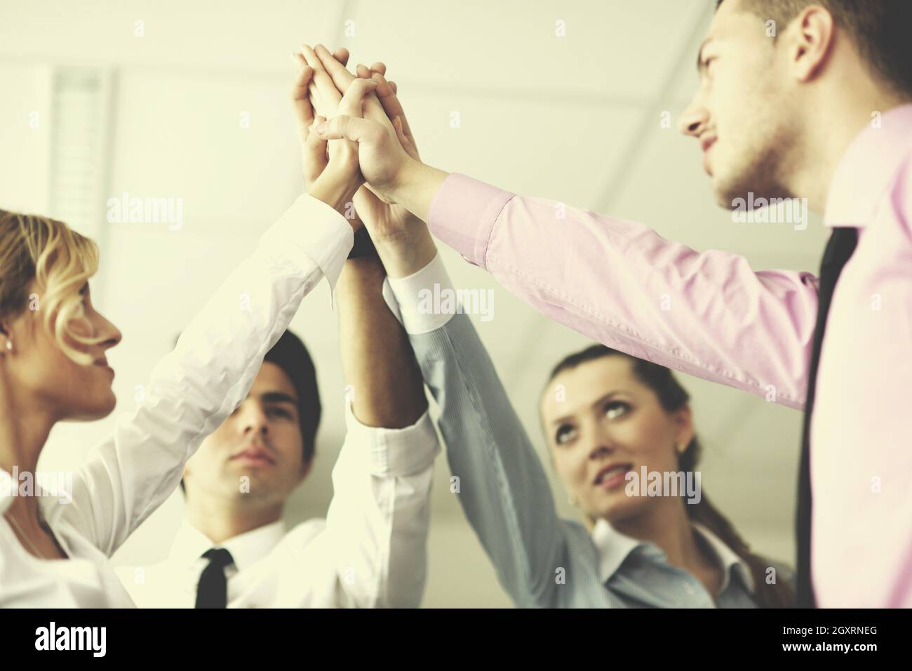 business people group joining hands and representing concept of friendship and teamwork, low ...