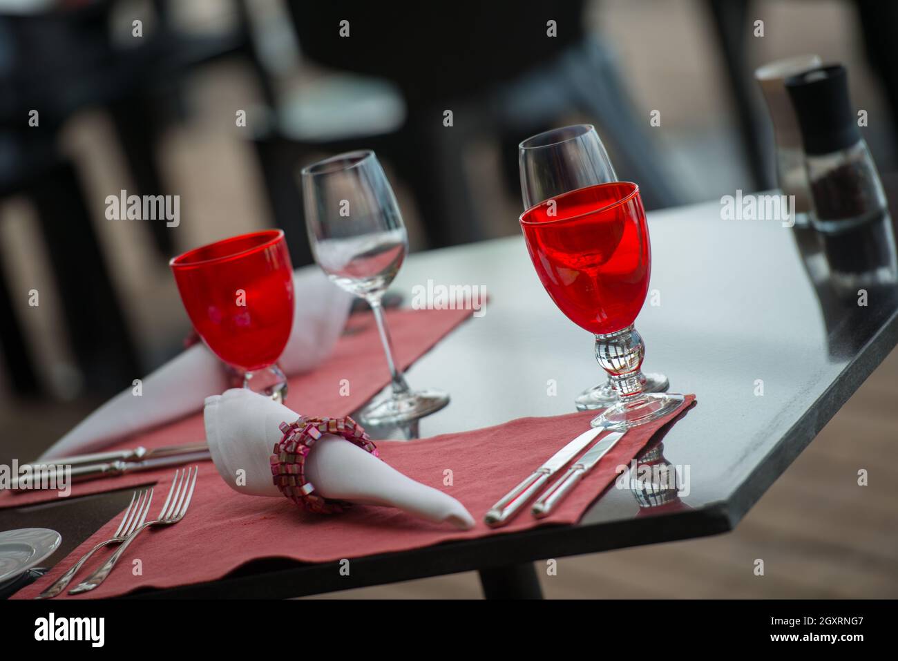 table setting at modern tropical restaurant Stock Photo - Alamy