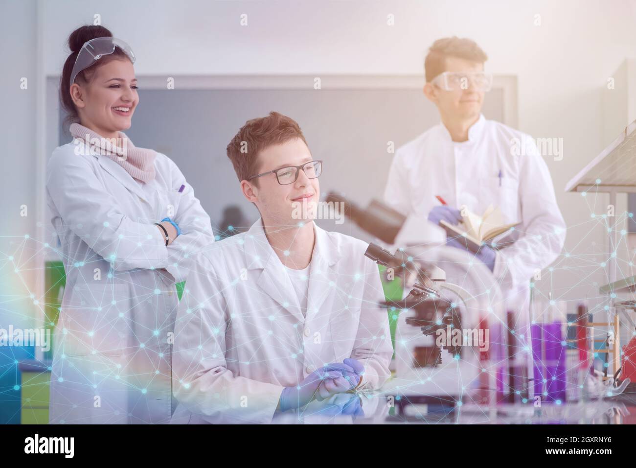 Group of young medical students doing research together in chemistry ...