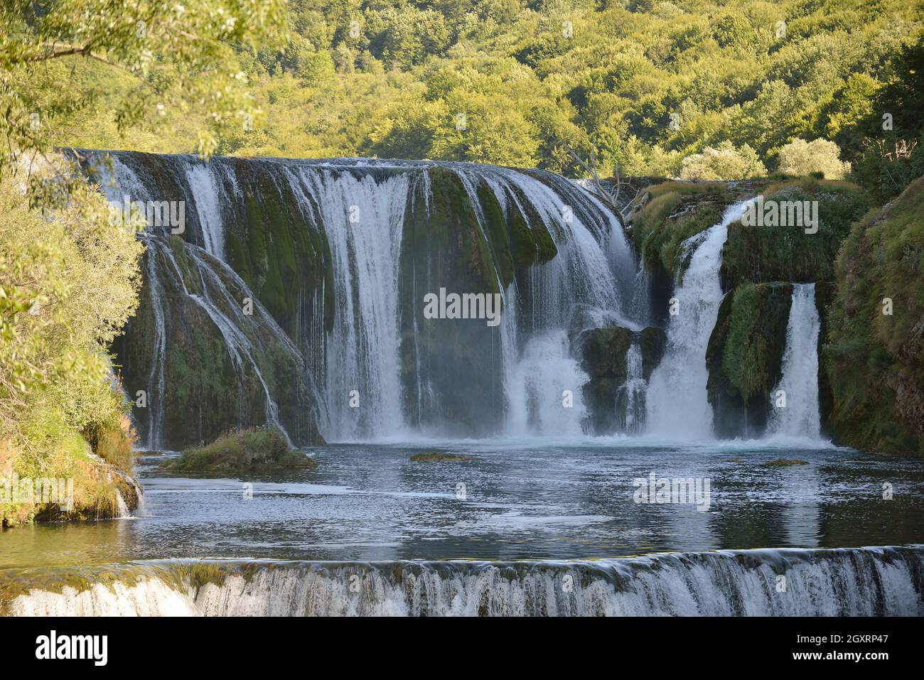 waterfall on wild river with fresh drinking water in summer Stock Photo ...