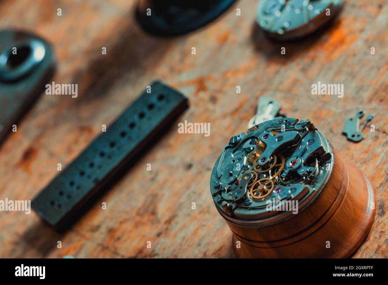 focus on Close up on an intricate old watch mechanism opened on a ...