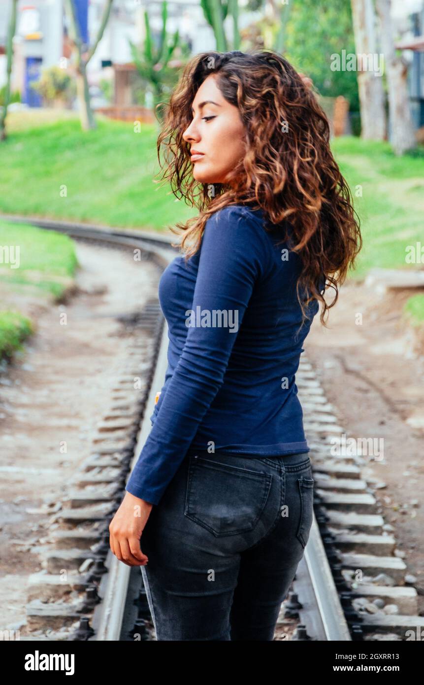 Portrait of beautiful young woman on railway platform Stock Photo - Alamy