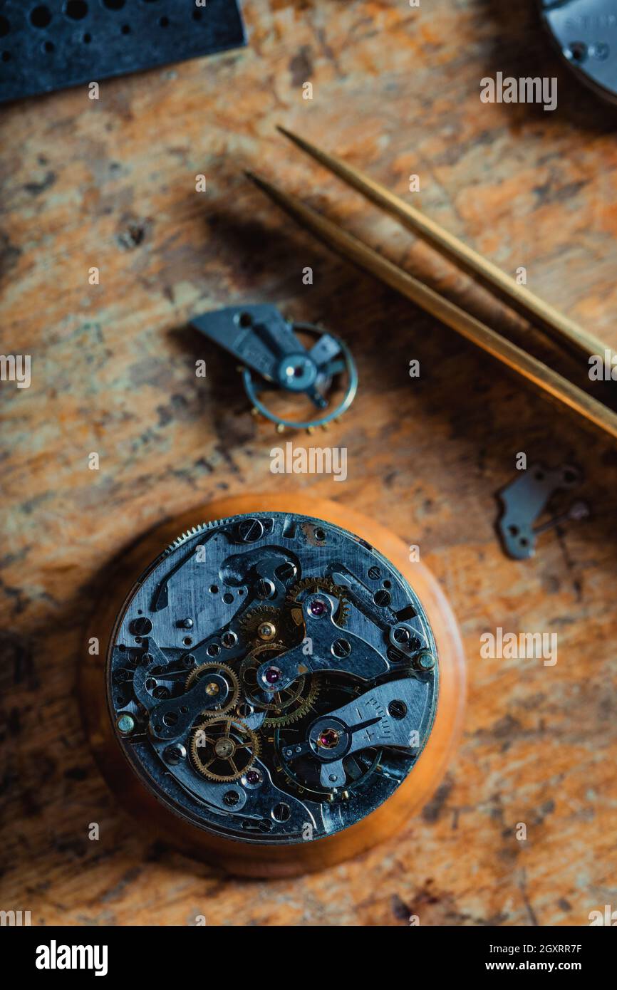 Top down view and selective focus of an old watch mechanism on a ...