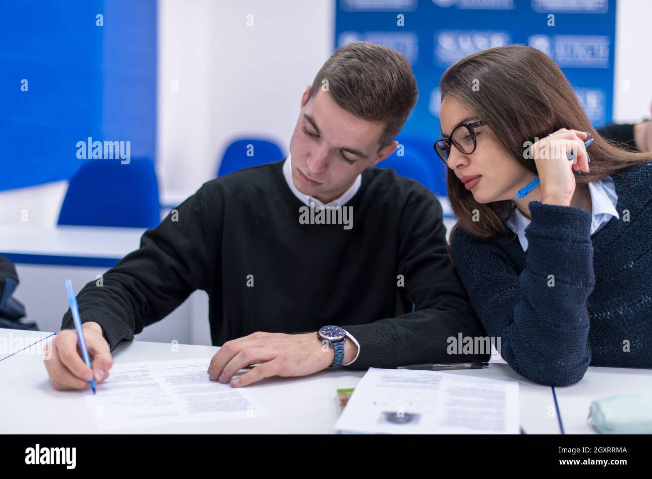 Two students working together classroom hi-res stock photography and ...