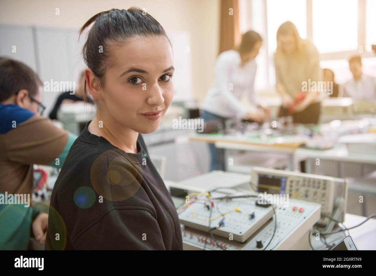 Group of young students doing technical vocational practice with ...