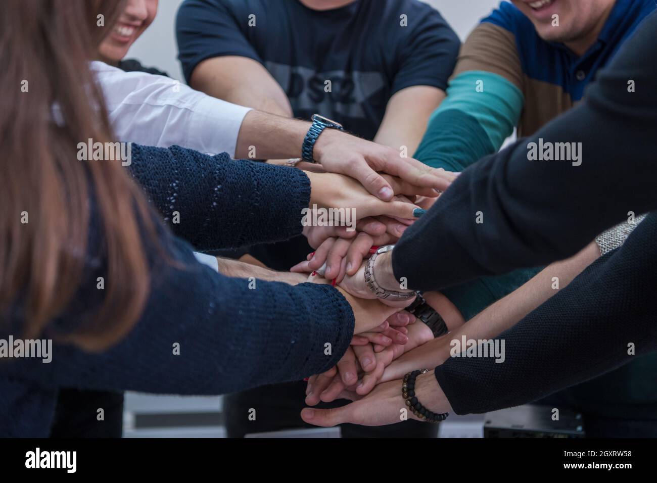 Group of young students in electronics classroom celebrating ...