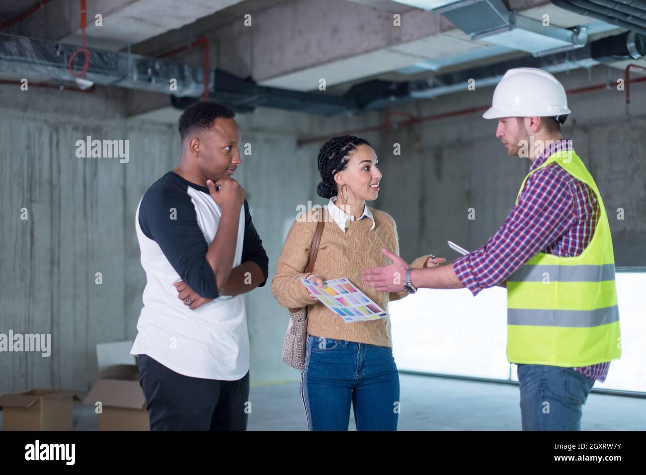 architect engineer using tablet computer while showing house design ...